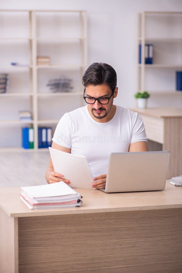 Young Male Student Employee at Workplace Stock Photo - Image of reading ...