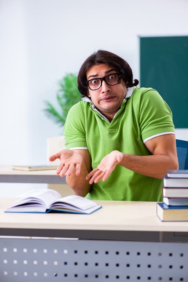 Young Male Student in Front of Green Board Stock Photo - Image of ...