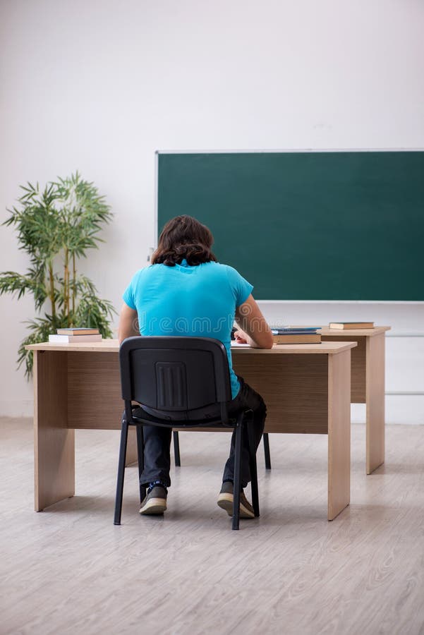 Young Male Student in Front of Green Board Stock Image - Image of class ...