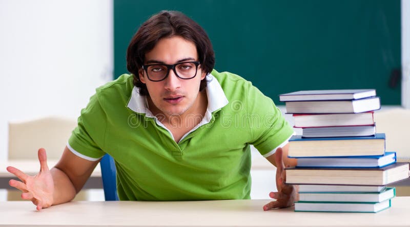 Young Male Student in Front of Green Board Stock Photo - Image of ...