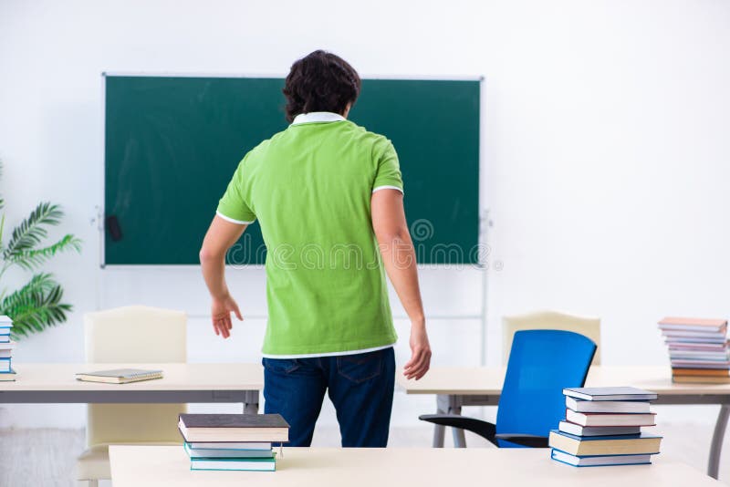 The Young Male Student in Front of Green Board Stock Image - Image of ...