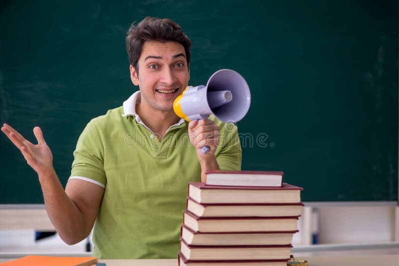 Young Male Student Holding Megaphone in the Classroom Stock Photo ...