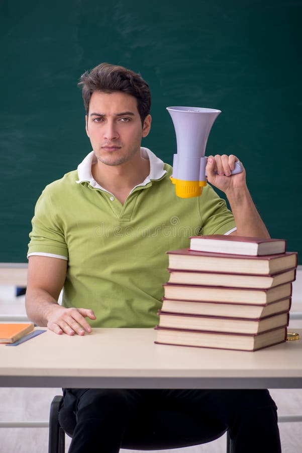 Young Male Student Holding Megaphone in the Classroom Stock Image ...