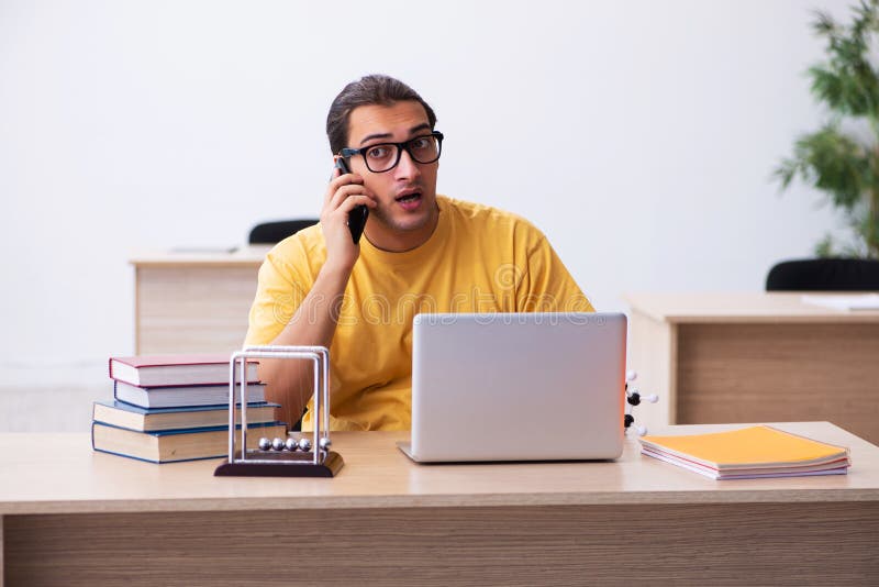 Young Male Student Holding Mobile Phone during Exam Preparation Stock ...