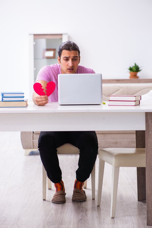 Young Male Student in One-sided Love Concept at Home Stock Image ...