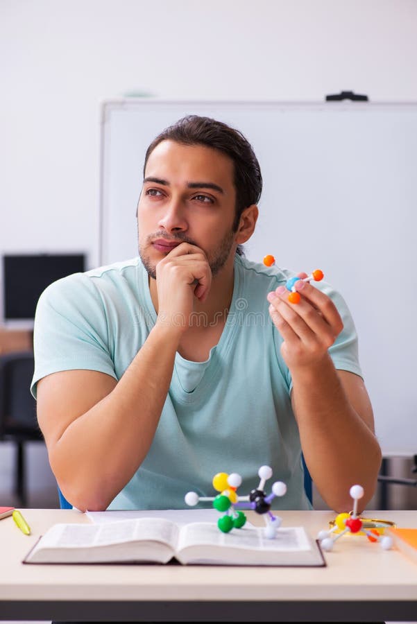 Young Male Student Physicist Studying Molecular Model at Home Stock ...