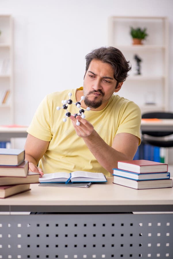 Young Male Student Physics Looking at Molecular Model Stock Image ...