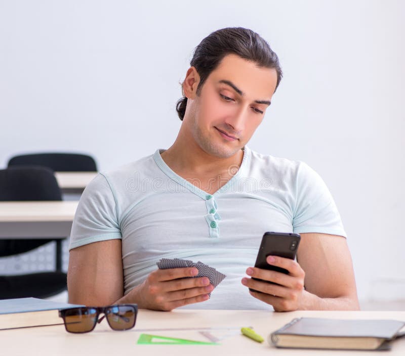 Young Male Student Playing Cards during Exam Preparation in the Stock ...