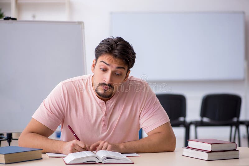 Young Male Student Preparing for Exams in the Classroom Stock Image - Image of teacher ...