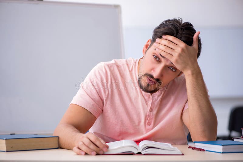 Young Male Student Preparing for Exams in the Classroom Stock Image ...