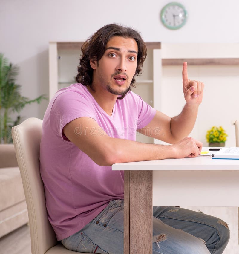 Young Male Student Preparing for Exams at Home Stock Photo - Image of ...