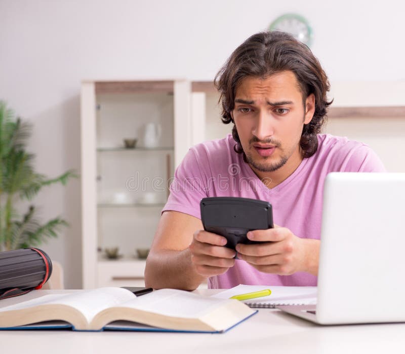Young Male Student Preparing for Exams at Home Stock Photo - Image of ...