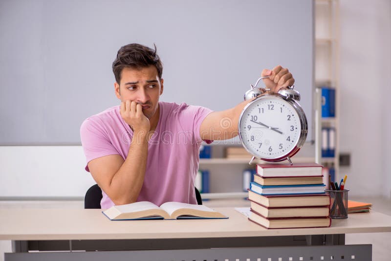 Young Male Student Preparing for Exams in Time Management Concep Stock ...