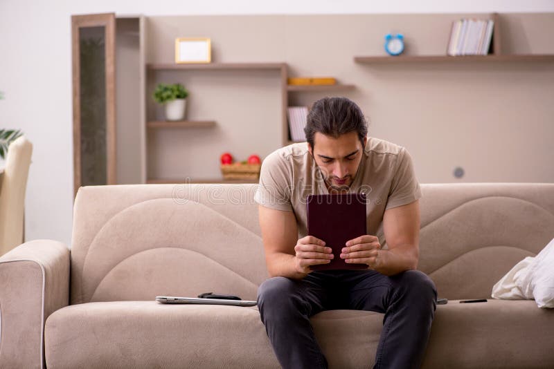 Young Male Student Reading Book at Home Stock Image - Image of social ...
