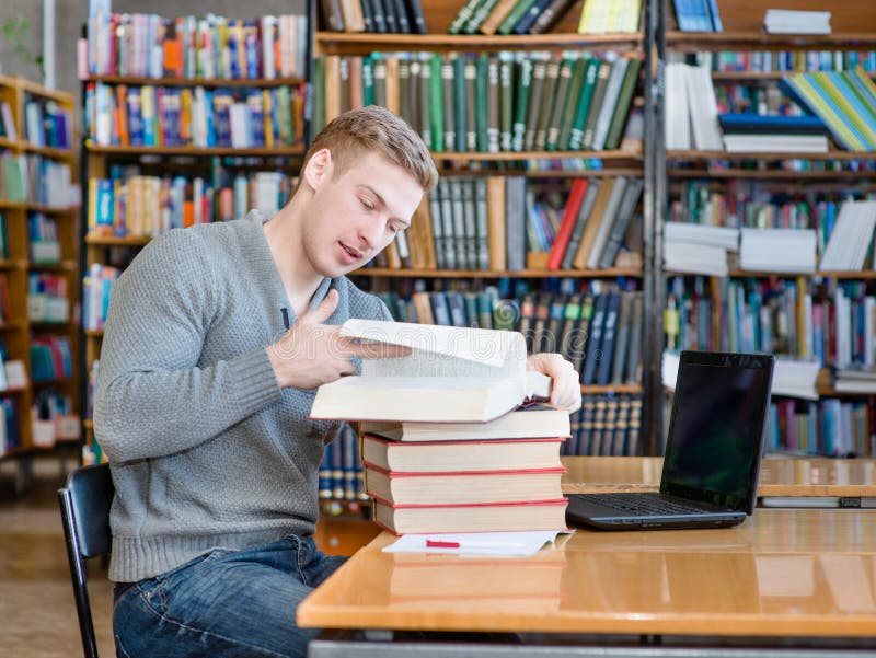 Young Male Student Reading Book in Library Stock Image - Image of learn ...