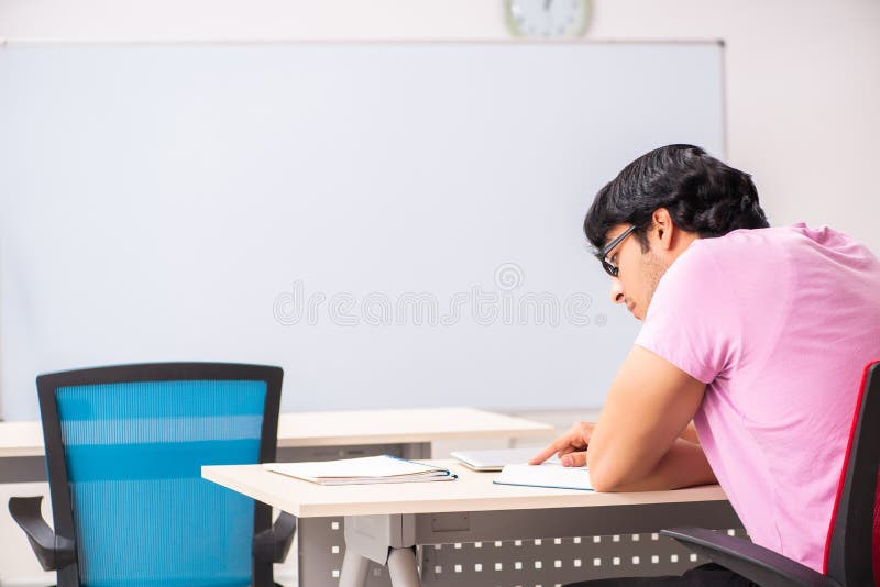 The Young Male Student Sitting in the Class Stock Image - Image of ...