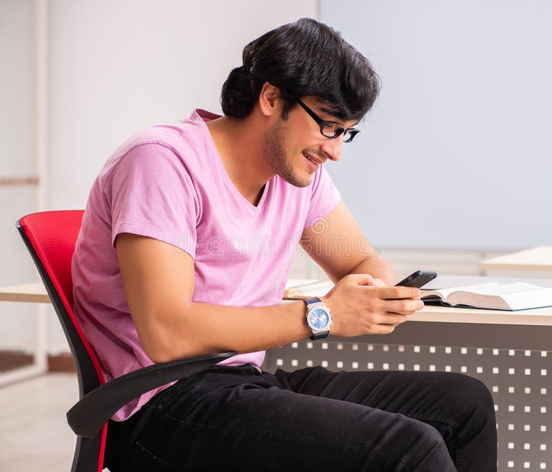 The Young Male Student Sitting in the Class Stock Image - Image of ...
