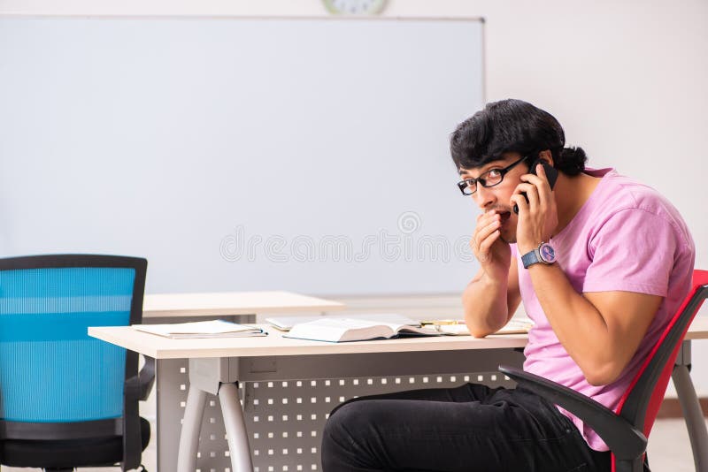 The Young Male Student Sitting in the Class Stock Image - Image of ...