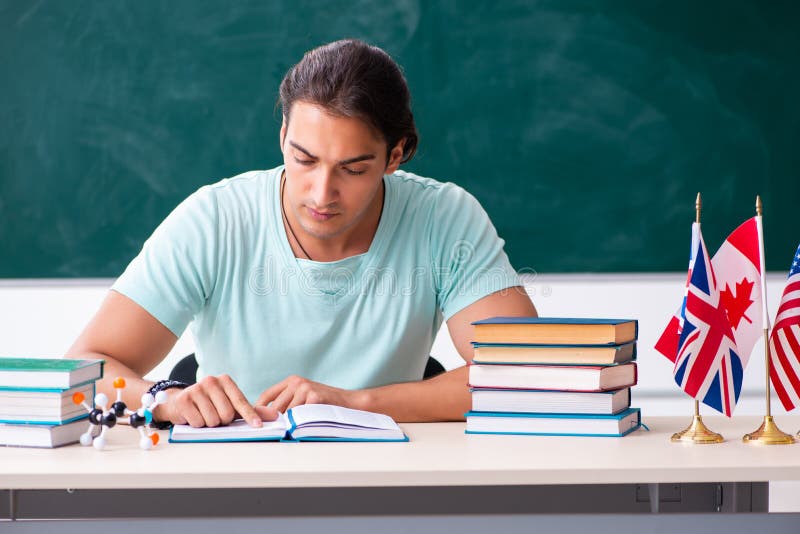 Young Male Student Sitting in the Classroom Stock Photo - Image of ...