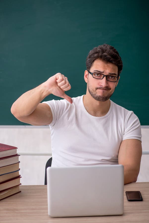 Young Male Student Sitting in the Classroom Stock Photo - Image of ...