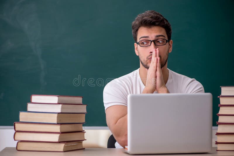 Young Male Student Sitting in the Classroom Stock Photo - Image of ...