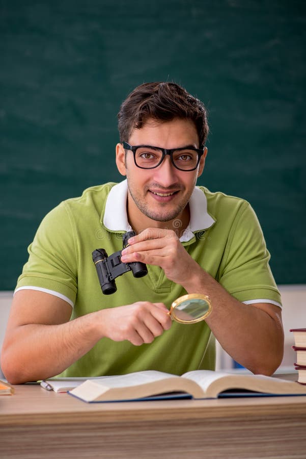 Young Male Student Sitting in the Classroom Stock Image - Image of ...