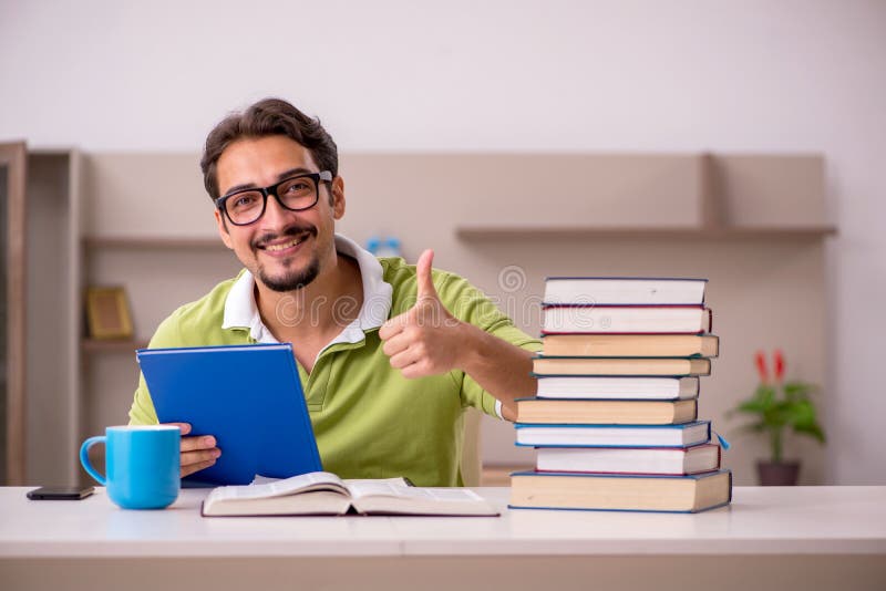 Young Male Student Studying at Home Stock Photo - Image of ...