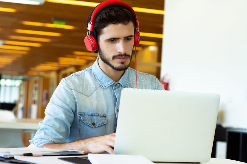 Young Male Student Studying in the Library Stock Photo - Image of ...