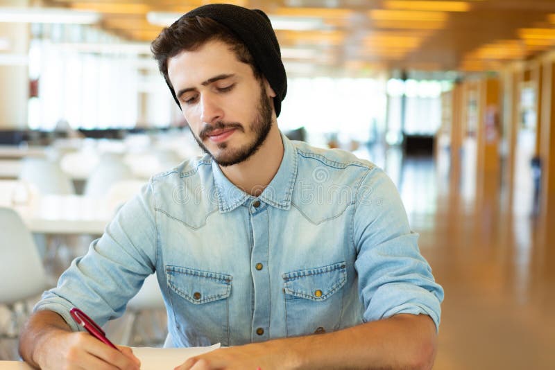 Young Male Student Studying in the Library Stock Photo - Image of ...
