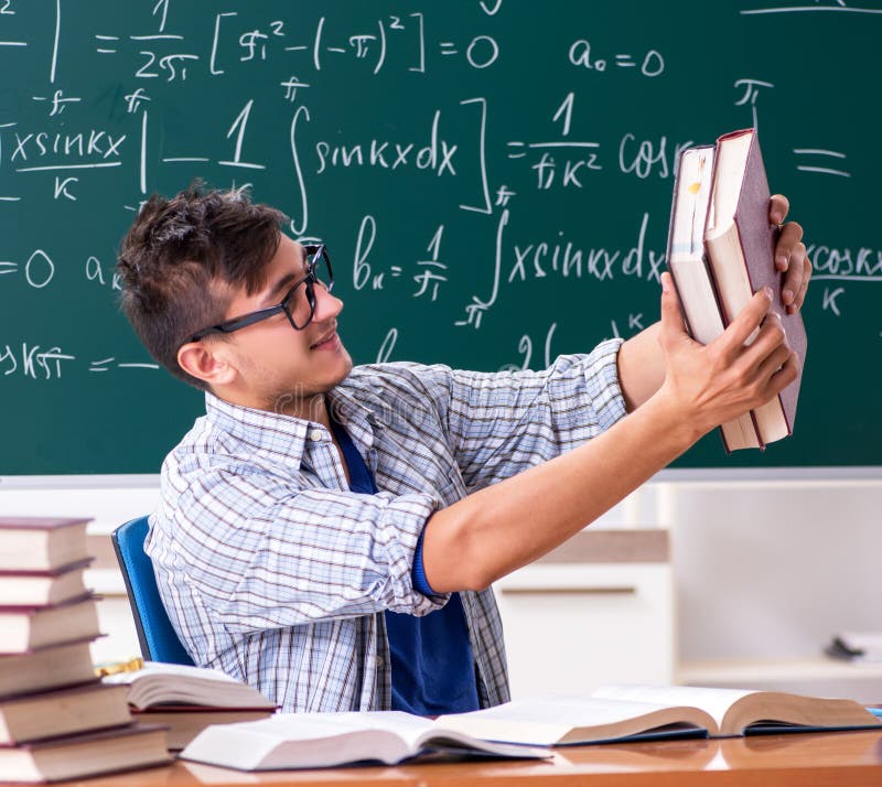 Young Male Student Studying Math at School Stock Photo - Image of ...