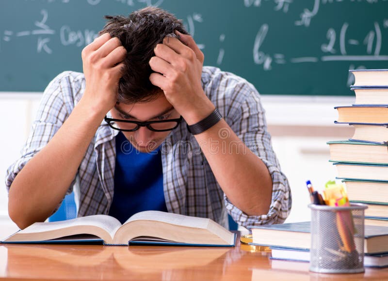 Young Male Student Studying Math at School Stock Photo - Image of math ...