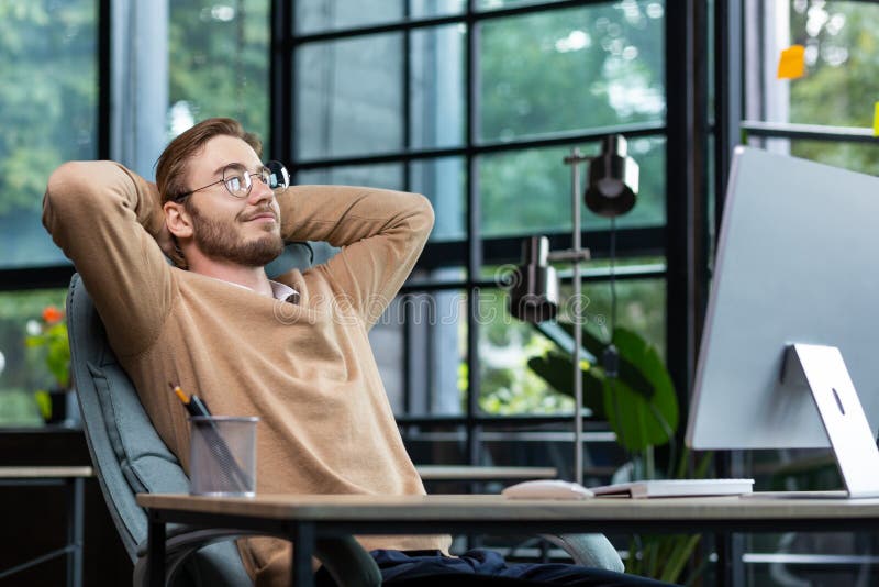 A Young Male Student is Taking a Break from Studying after an Online ...