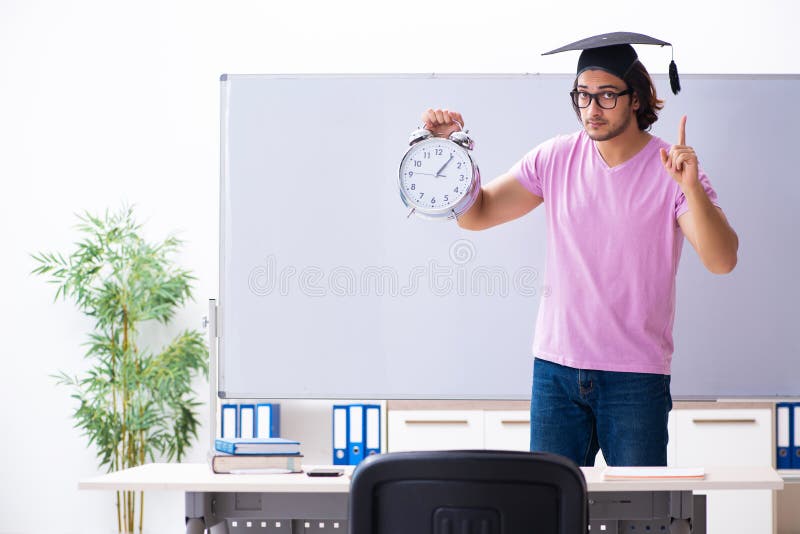 Young Male Student in Time Management Concept Stock Photo - Image of ...