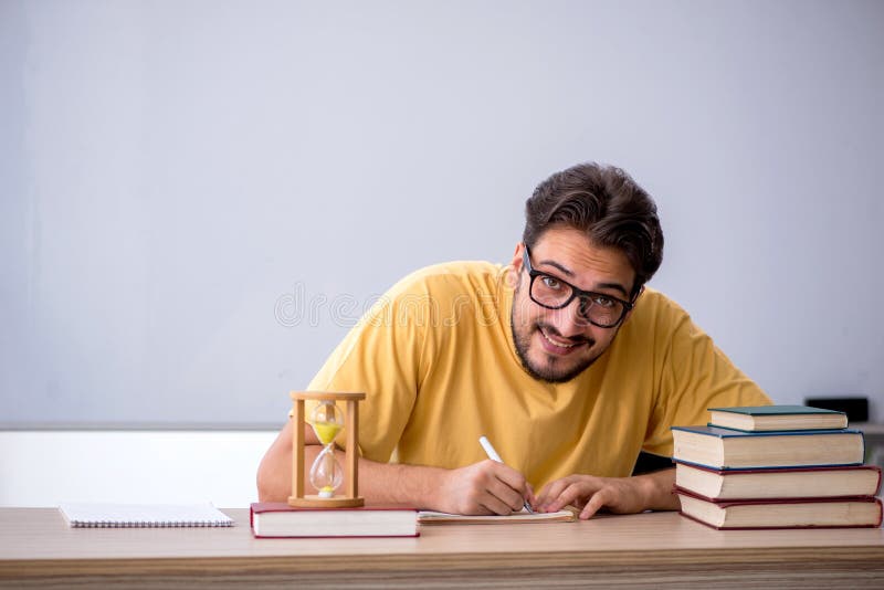 Young Male Student in Time Management Concept Stock Image - Image of ...