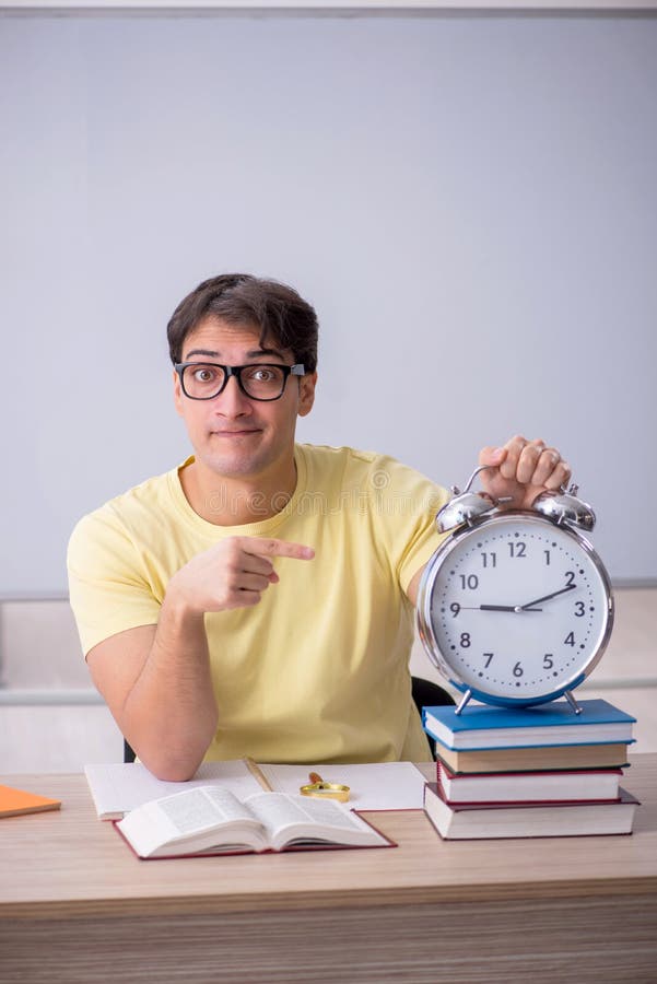 Young Male Student in Time Management Concept Stock Image - Image of ...