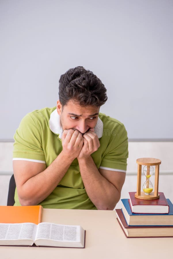 Young Male Student in Time Management Concept Stock Photo - Image of ...