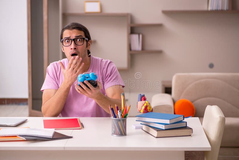 Young Male Student in Time Management Concept Stock Image - Image of ...