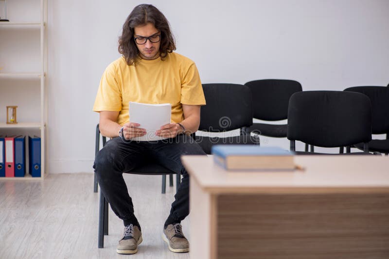 Young Male Student Waiting for Teacher in the Classroom Stock Image ...