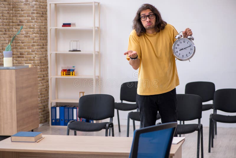 Young Male Student Waiting for Teacher in the Classroom Stock Image ...