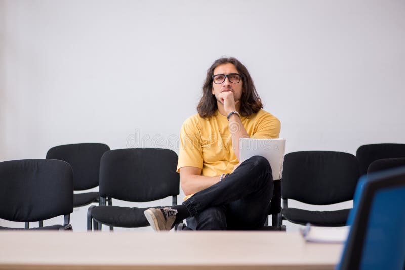 Young Male Student Waiting for Teacher in the Classroom Stock Photo ...
