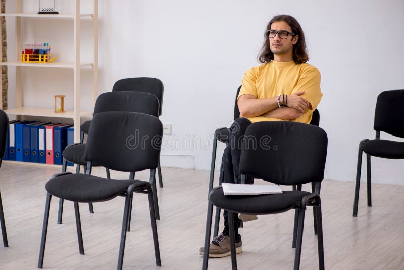 Young Male Student Waiting for Teacher in the Classroom Stock Photo ...