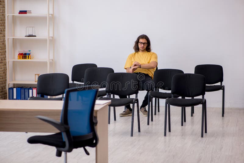 Young Male Student Waiting for Teacher in the Classroom Stock Photo ...
