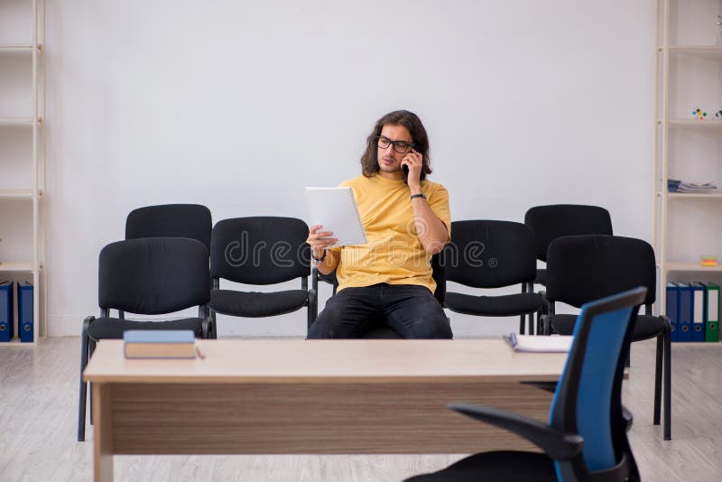 Young Male Student Waiting for Teacher in the Classroom Stock Photo ...