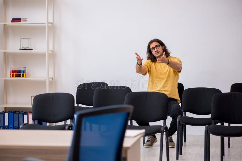 Young Male Student Waiting for Teacher in the Classroom Stock Image ...