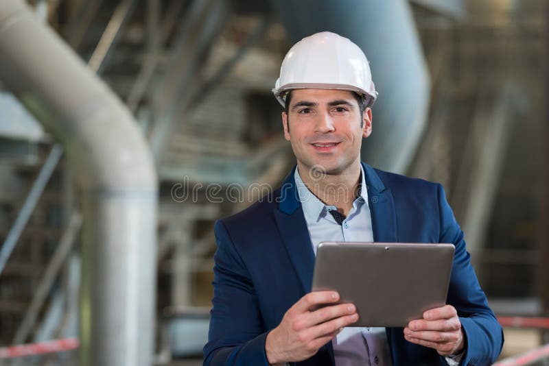 Young Male Supervisor Using Tablet Pc in Industry Stock Image - Image ...