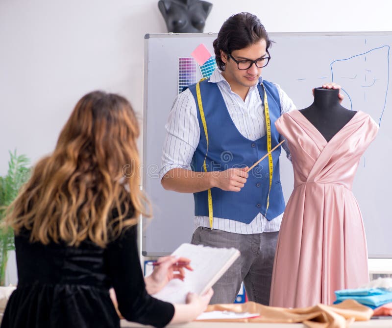 Young Male Tailor Teaching Female Student Stock Image - Image of notes ...