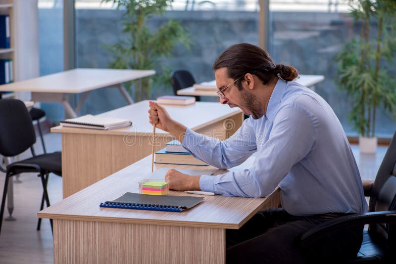 Young Male Teacher in the Classroom Stock Image - Image of 2019ncov ...