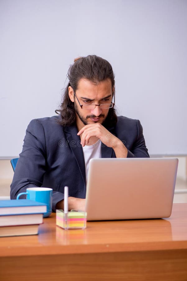 Young Male Teacher in the Classroom Stock Photo - Image of learning ...