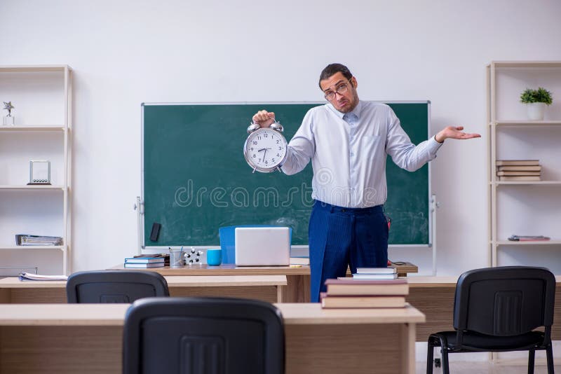 Young Male Teacher in Front of Green Board Stock Photo - Image of board ...