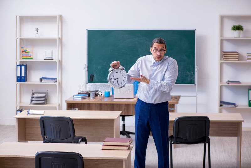 Young Male Teacher in Front of Green Board Stock Image - Image of ...